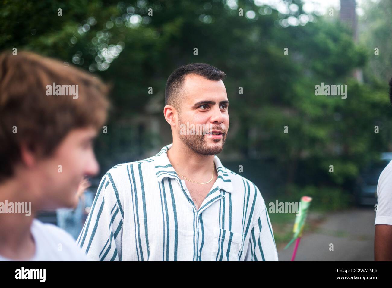 Neighbors getting together on holiday block party Stock Photo - Alamy