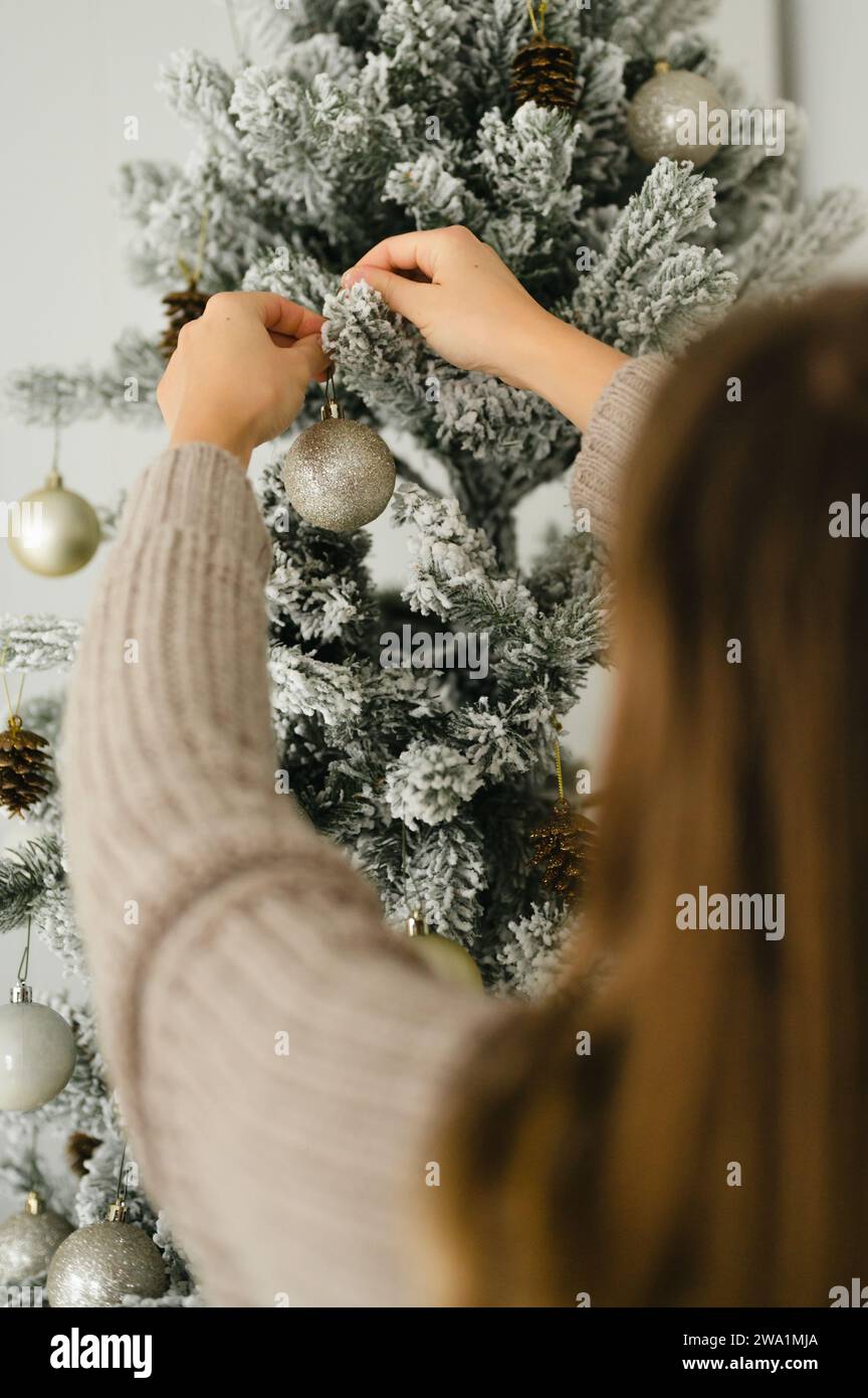 Womans hand decorating xmas tree hi-res stock photography and images ...