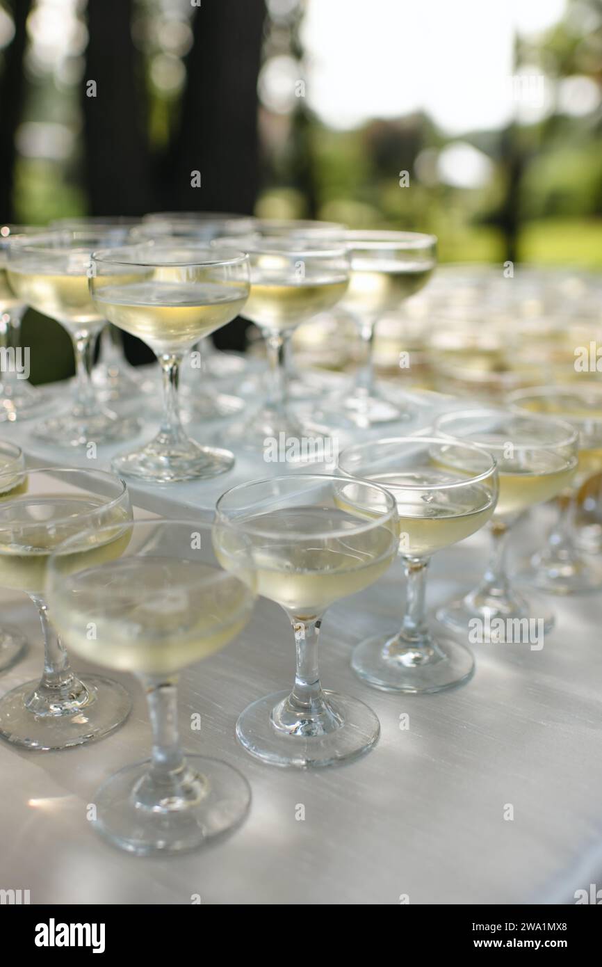 Stacked champagne glasses at an outdoor celebratory event Stock Photo ...