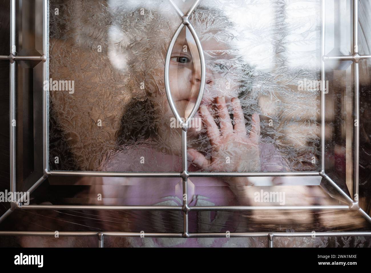 Child at home looking through window into the outdoors Stock Photo - Alamy