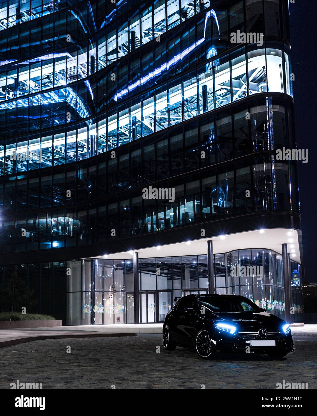 Mercedes Benz AMG A35 Black, In front of an Office Building lit up with ...