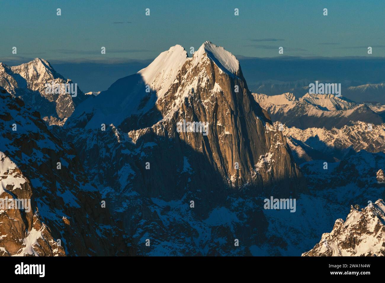 Sun sets on Broken Tooth mountain in Alaska Stock Photo - Alamy