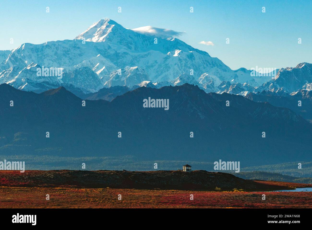 Small hut sits on a ridge in front the Denali in Alaska Stock Photo - Alamy