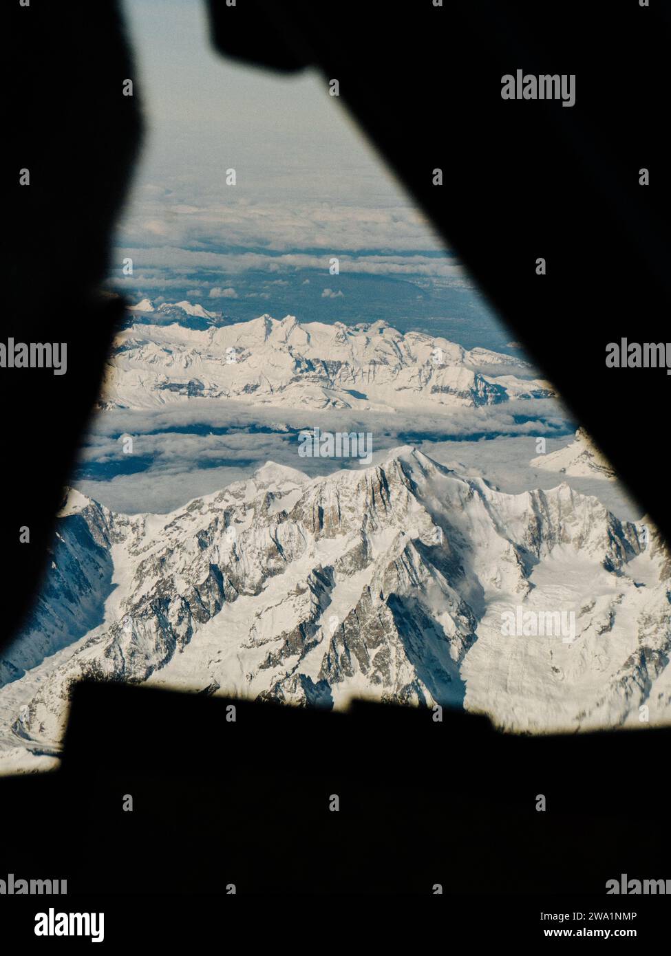 view from the airplane of mont blanc and the alps covered in snow Stock ...