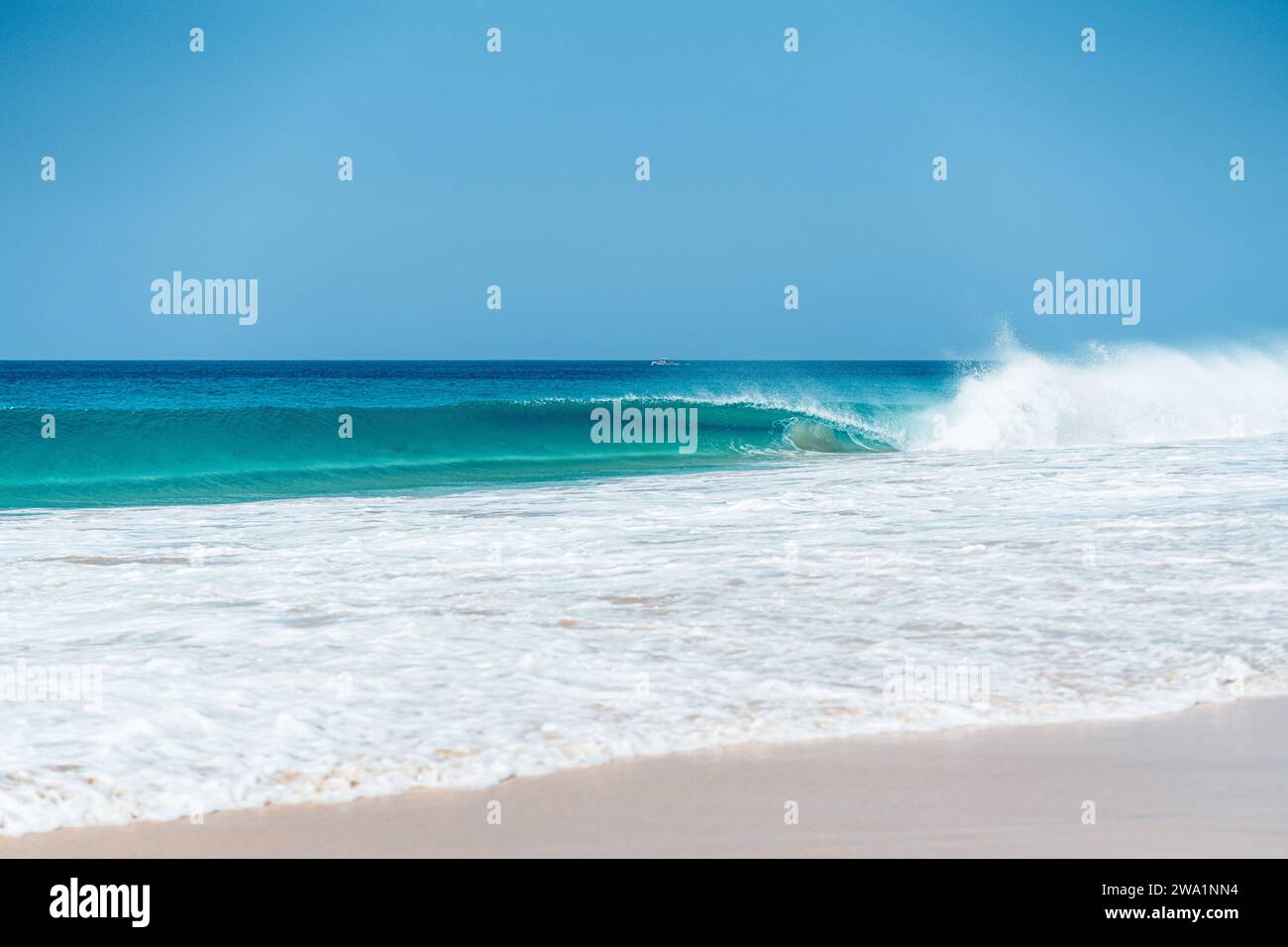 Turquoise blue ocean water, with the start of a wave forming Stock ...