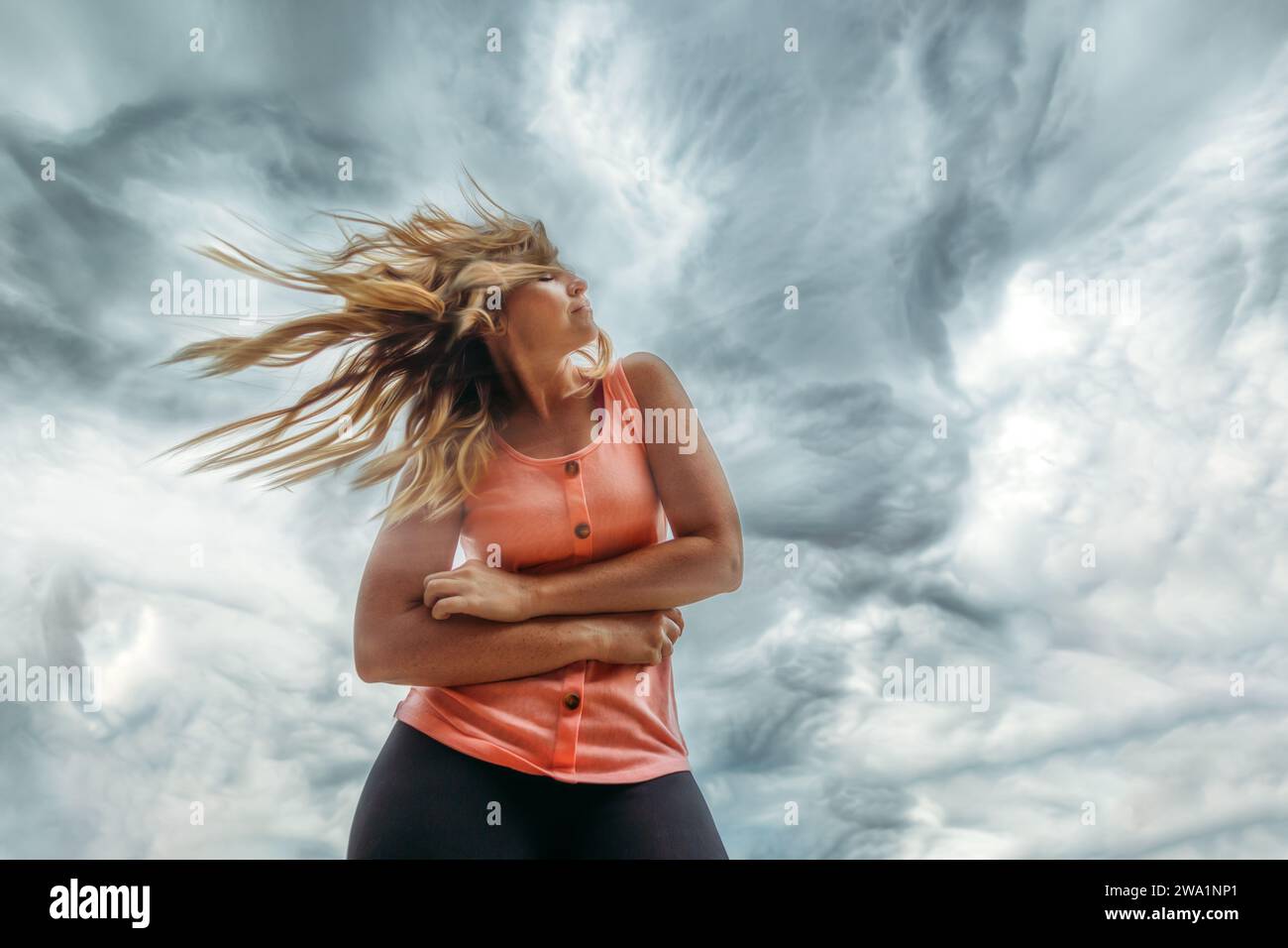 Strong wind blowing woman hi-res stock photography and images - Alamy