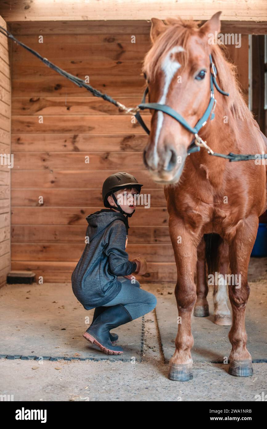 Teen boy riding horse hi-res stock photography and images - Alamy