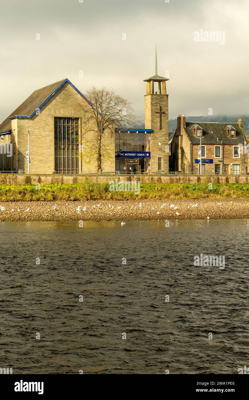 On Ness Walk, a cyclist rides across one of the historic suspension ...