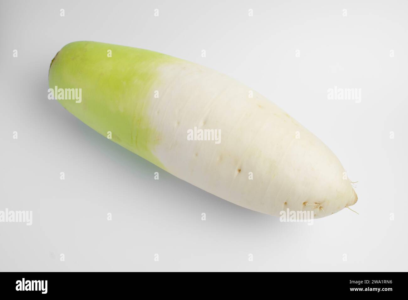 One radish root neatly arranged on a white background Stock Photo - Alamy