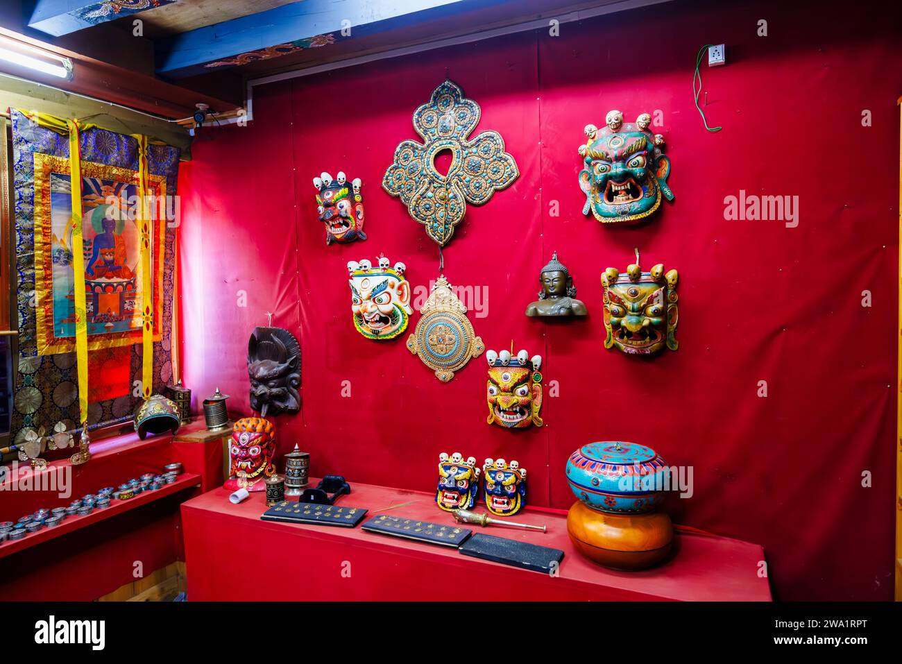 Traditional ceremonial masks and souvenirs on sale in Thokmed Yeshey ...