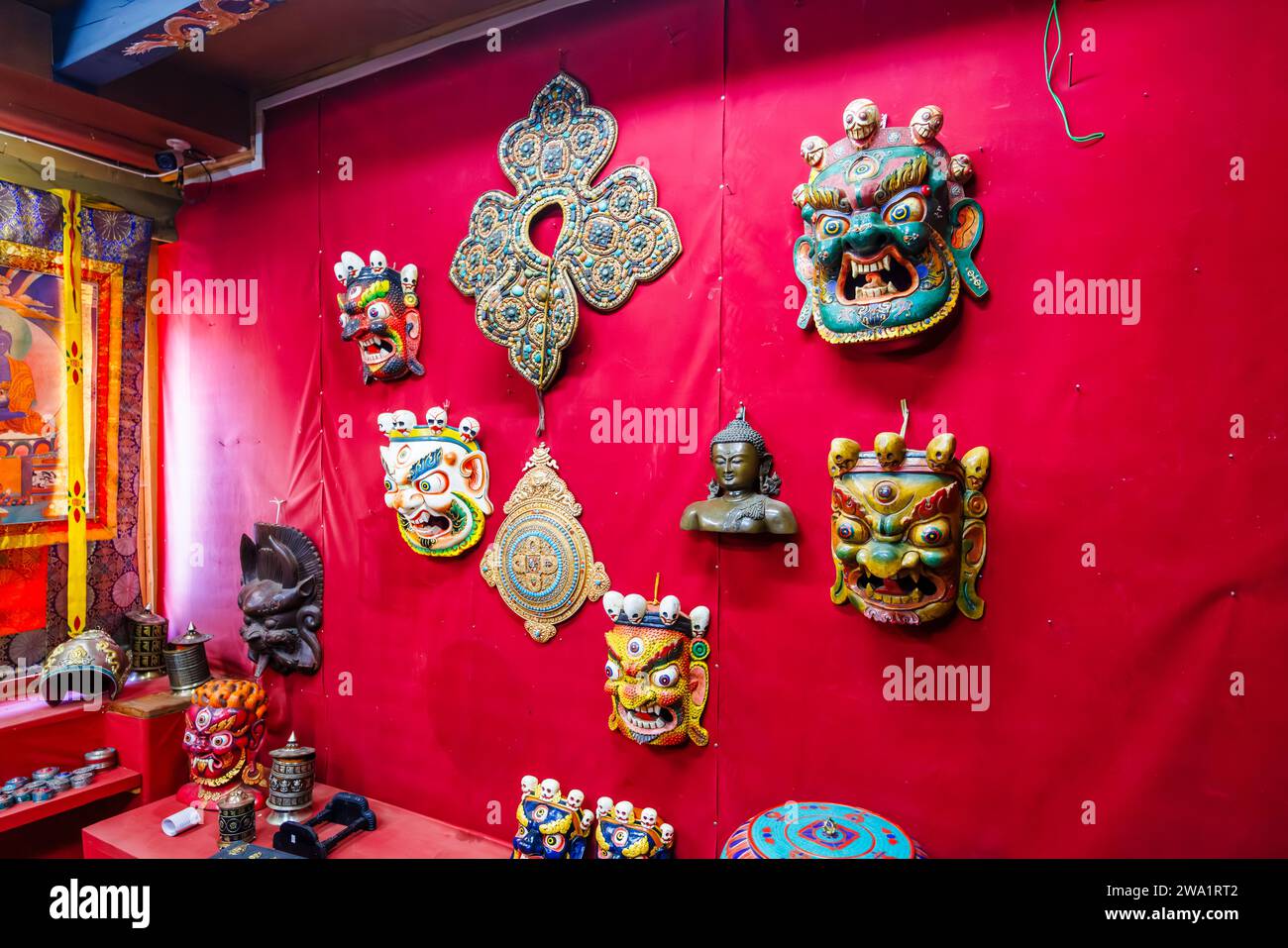 Traditional ceremonial masks and souvenirs on sale in Thokmed Yeshey ...