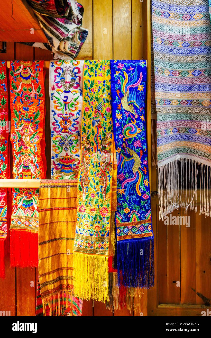 Colourful traditional scarves and textile souvenirs on sale in Thokmed ...