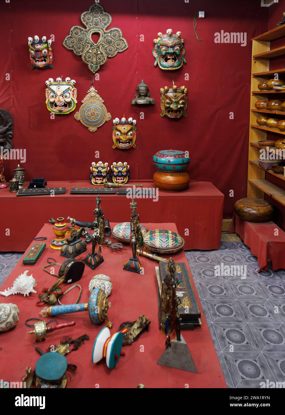 Traditional ceremonial masks and souvenirs on sale in Thokmed Yeshey ...