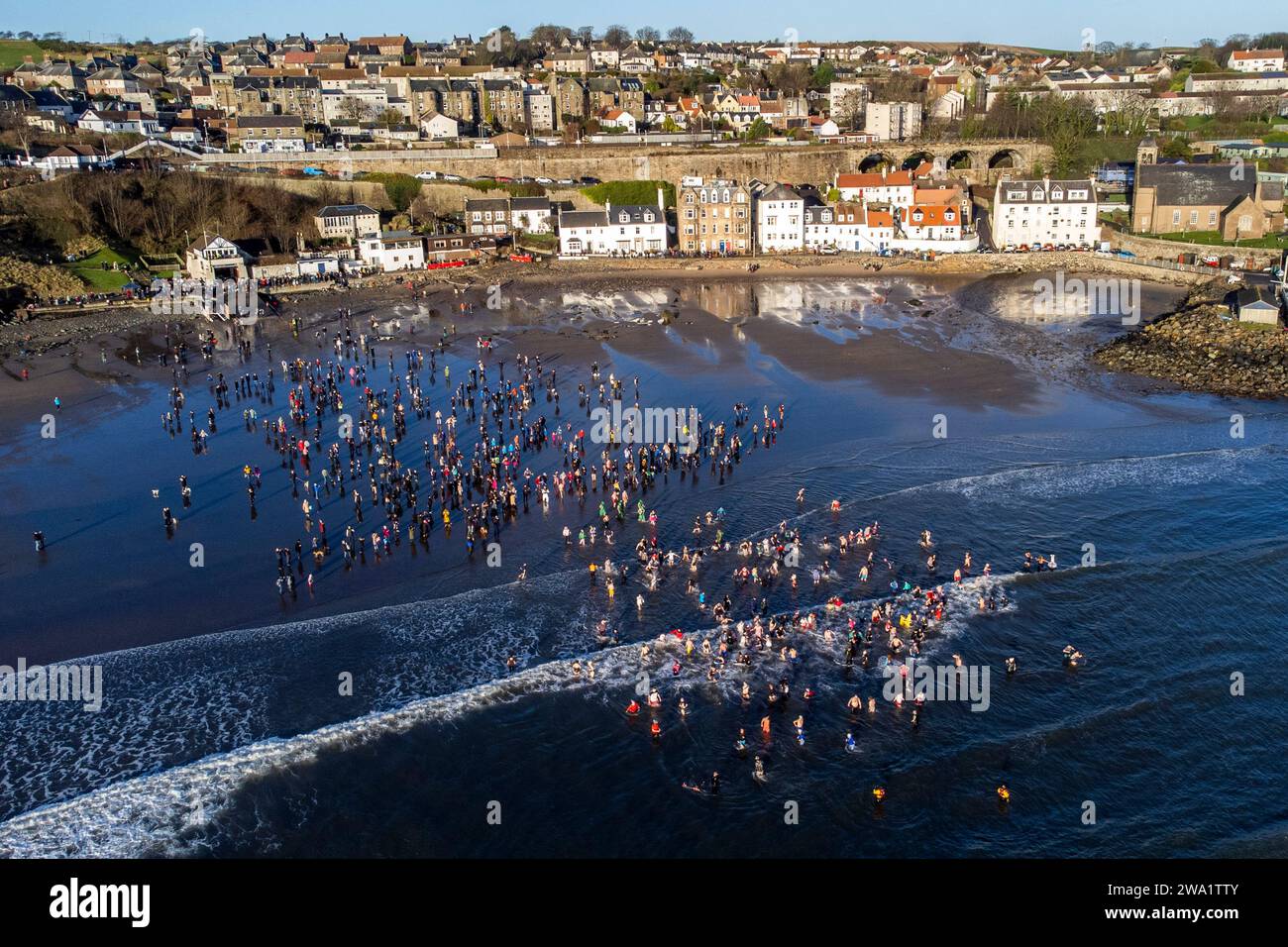 People take part in a Loony Dook New Year's Day dip in the Firth of ...