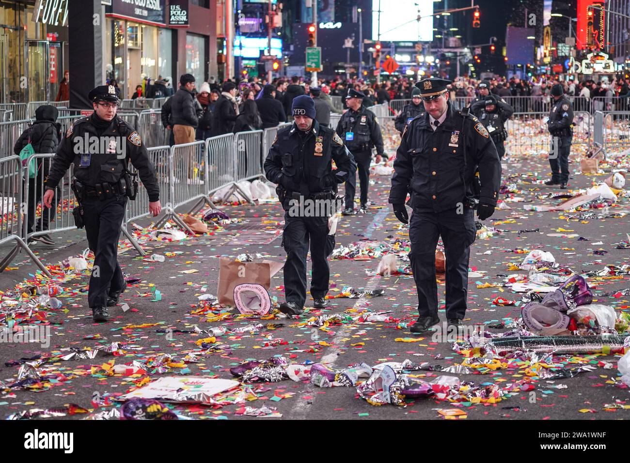 New York, United States. 01st Jan, 2024. Police officers walk at Times ...