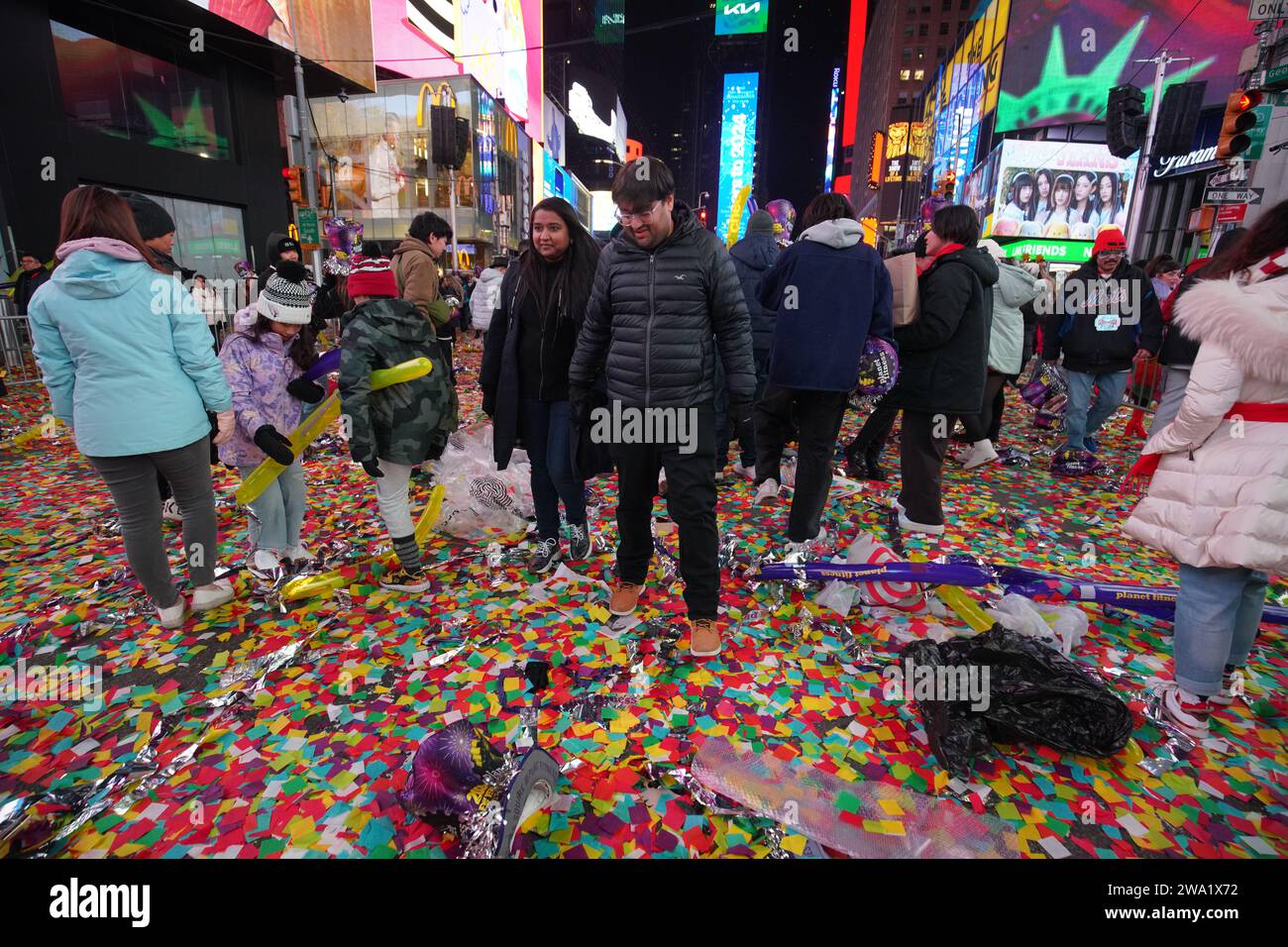 New York, United States. 01st Jan, 2024. People look at the confetti ...