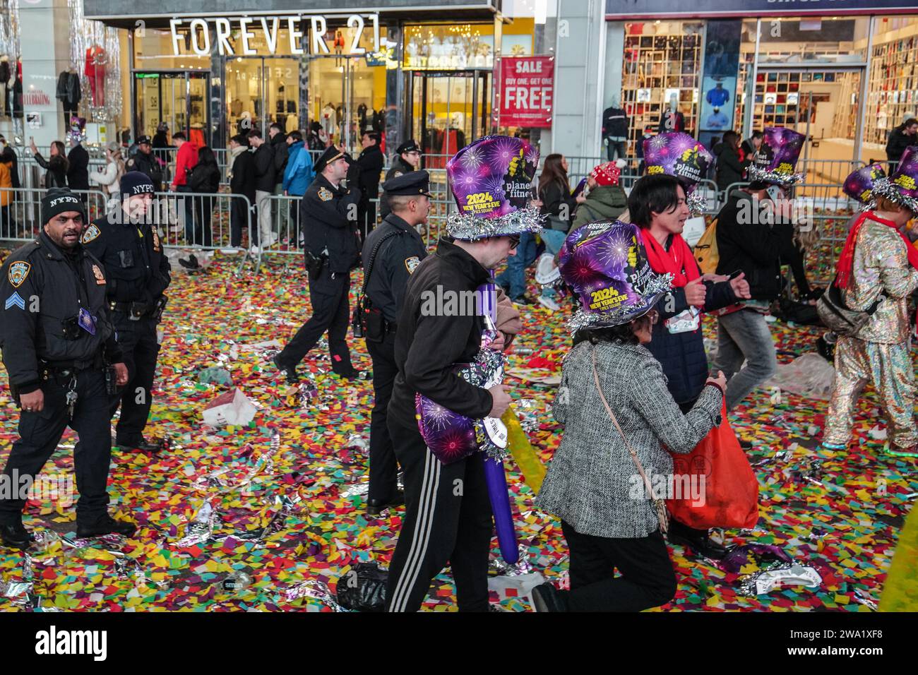 New York, United States. 01st Jan, 2024. Police officers require people ...