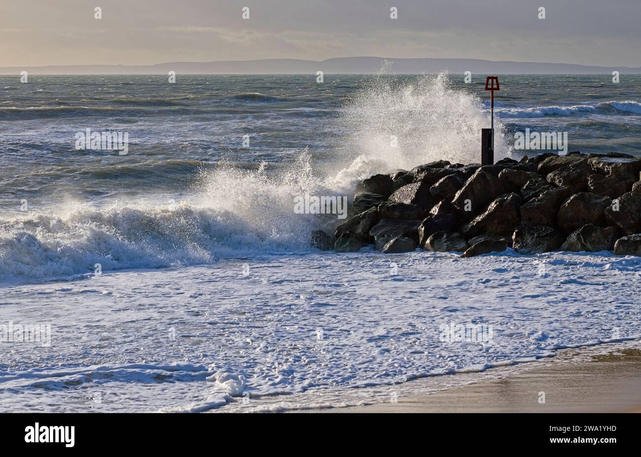 winter storm waves crashing onto a beach Stock Photo - Alamy