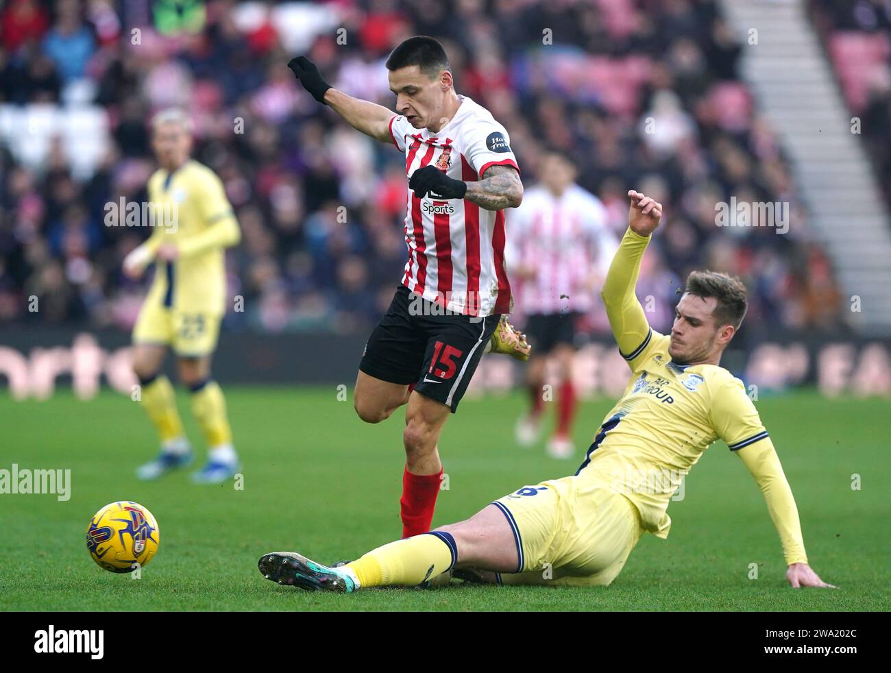 Preston North End's Liam Lindsay (right) challenges Sunderland's ...