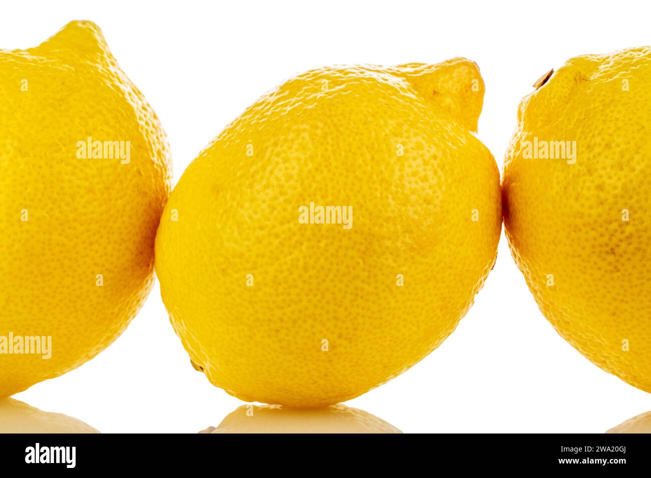 Three yellow juicy lemons, macro, isolated on white background Stock ...