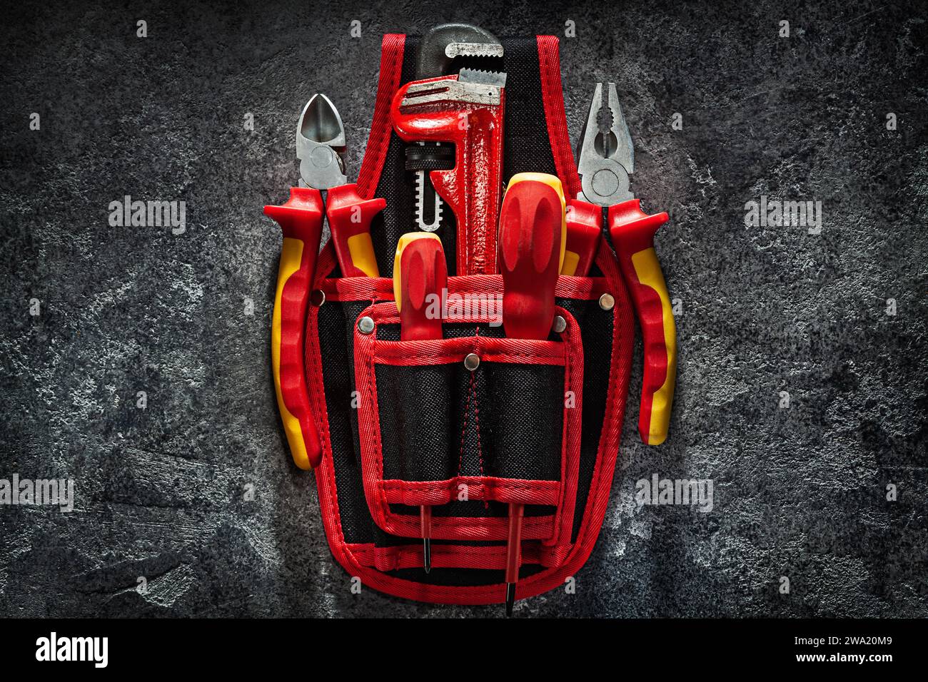 Red Working Tools In Tool Belt On Black Background Stock Photo - Alamy