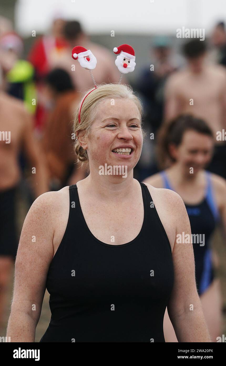 Swimmers make their way to the water to take part in the annual New ...
