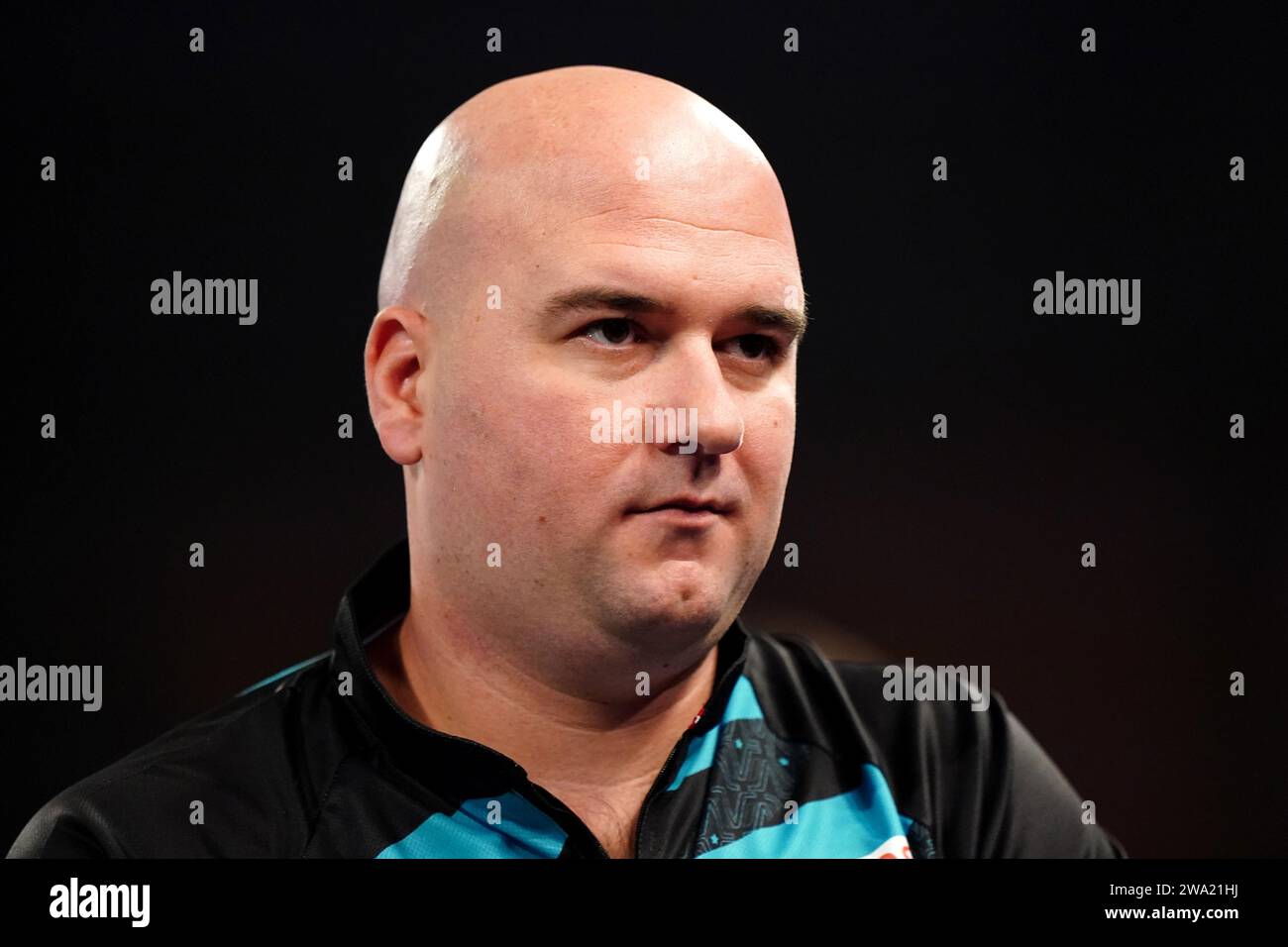 Rob Cross in action against Chris Dobey (not pictured) on day fourteen ...