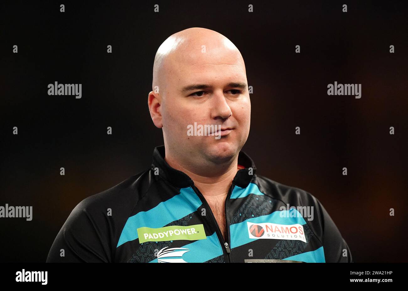 Rob Cross in action against Chris Dobey (not pictured) on day fourteen ...