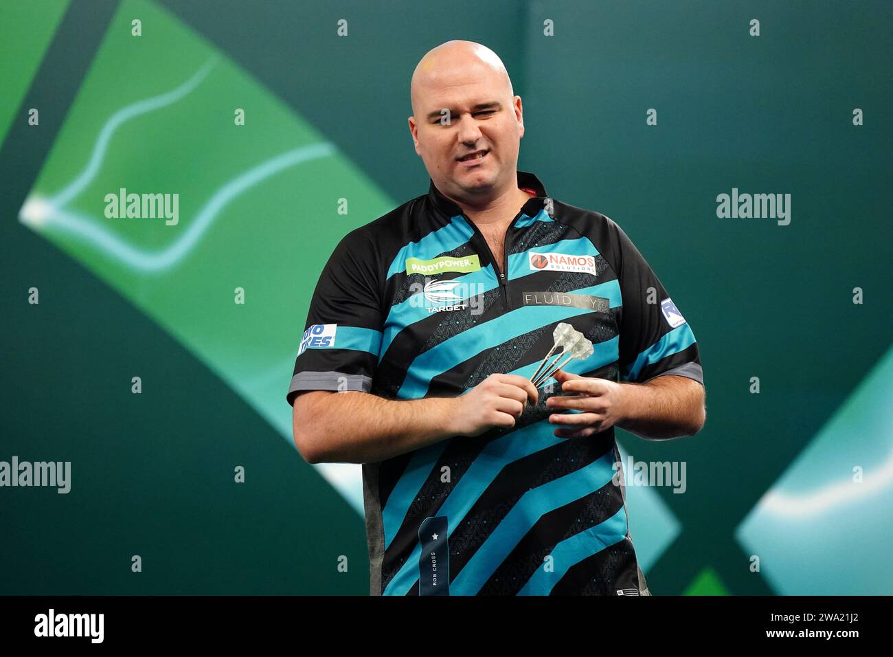 Rob Cross in action against Chris Dobey (not pictured) on day fourteen ...