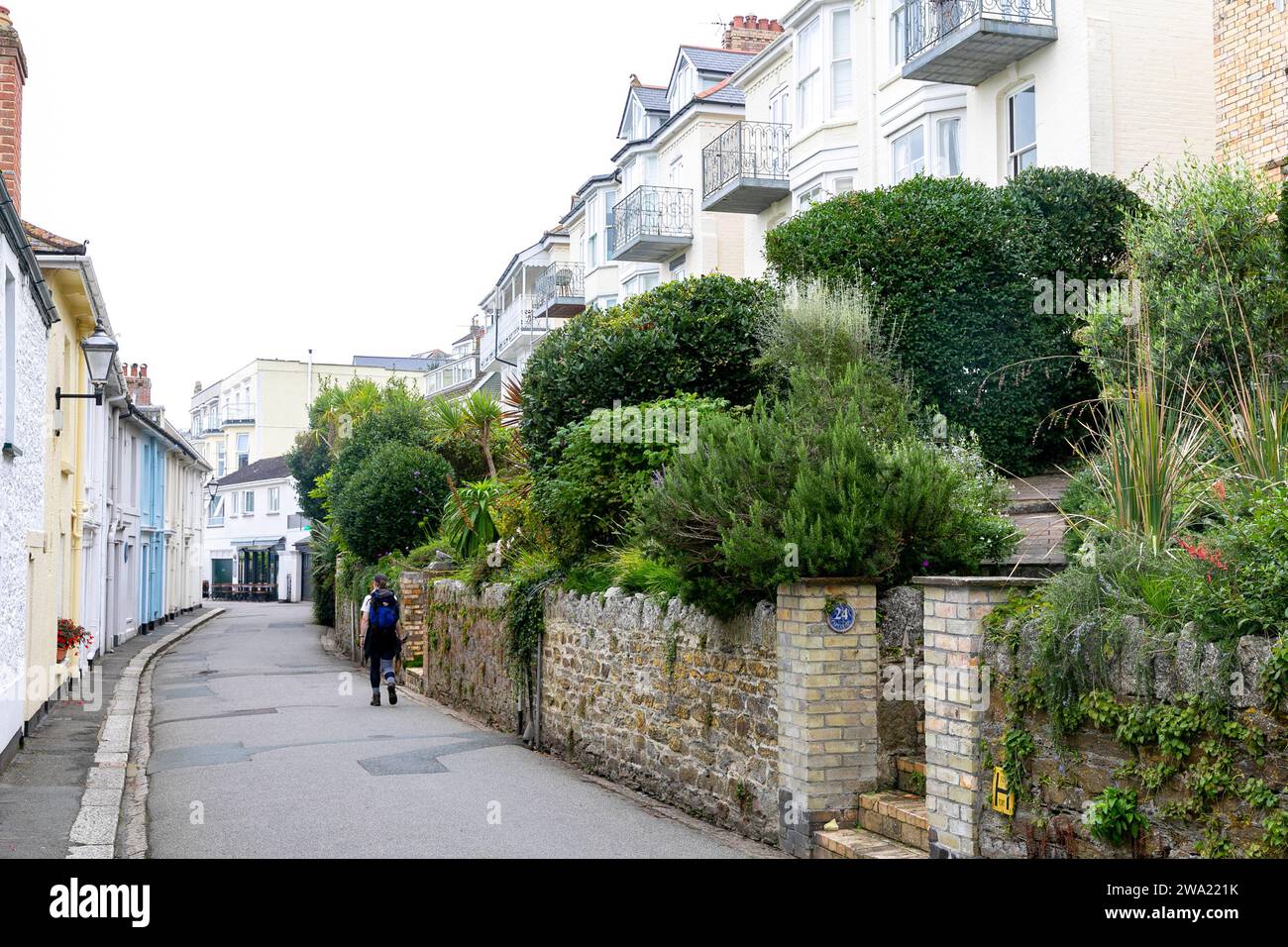 Fowey town centre in Cornwall and one of its narrow streets with homes ...
