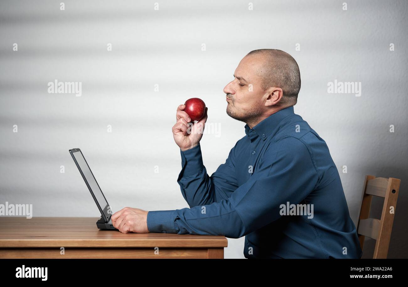 Male teacher eating apple hi-res stock photography and images - Alamy