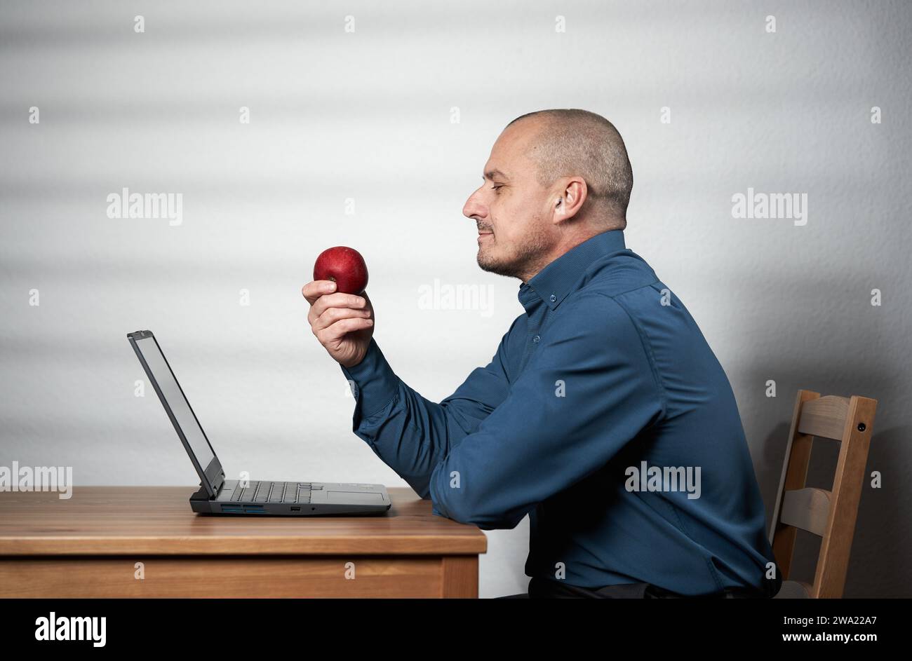 Male teacher eating apple hi-res stock photography and images - Alamy