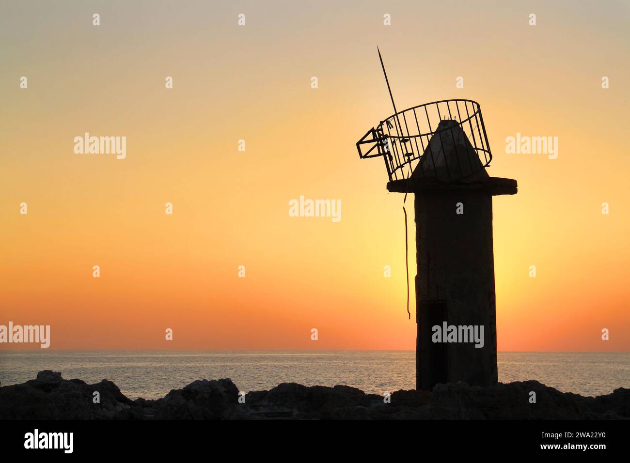 A ruined lighthouse in the coastal town of Batroun, Lebanon Stock Photo ...