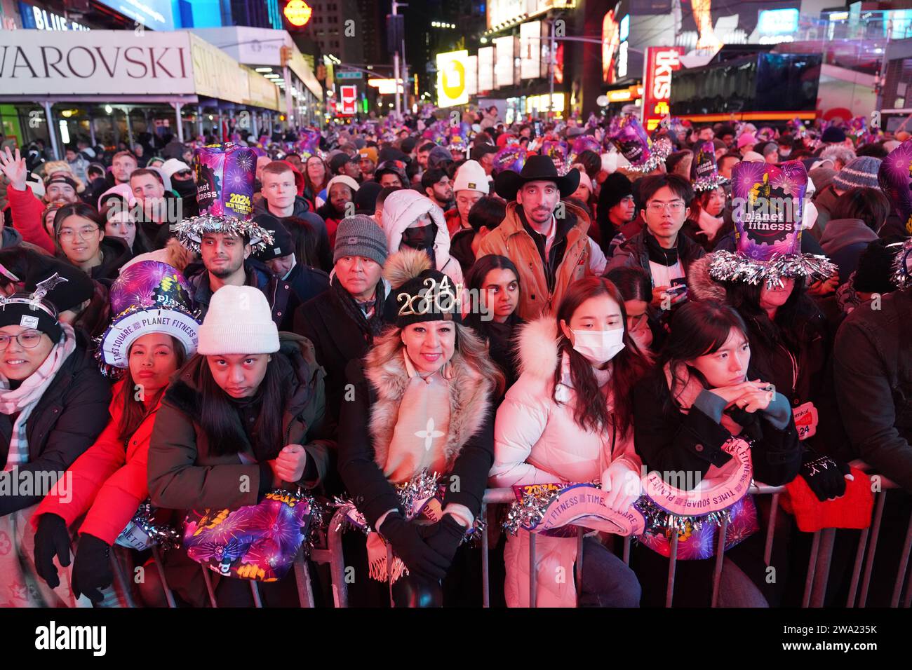 People gather at Times Square during the celebration. The 2024 Times ...