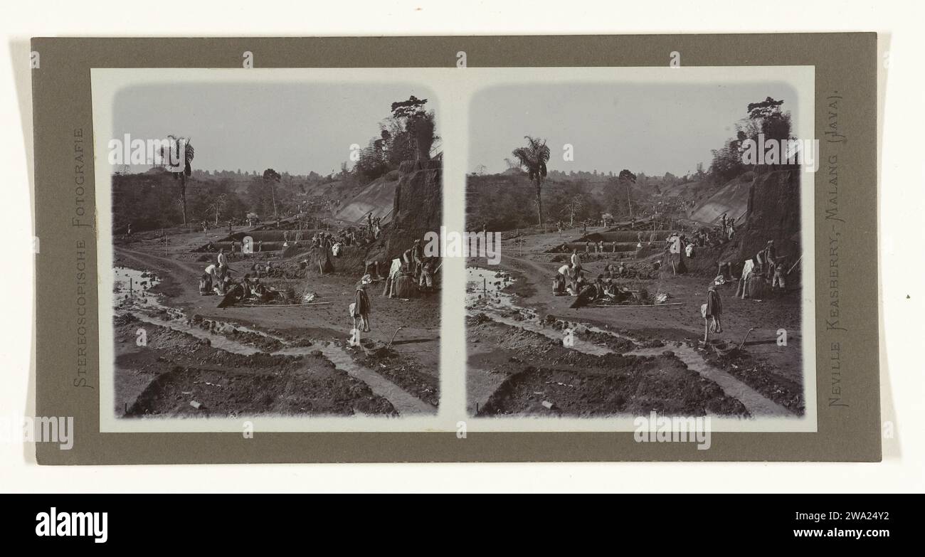 Excaving handles and water basins by hand for an irrigation system, c ...