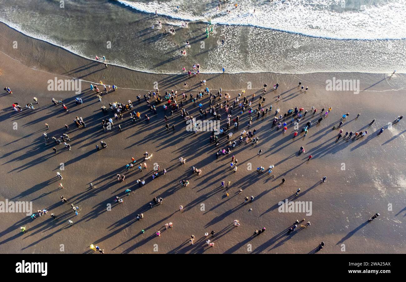 People take part in a Loony Dook New Year's Day dip in the Firth of ...