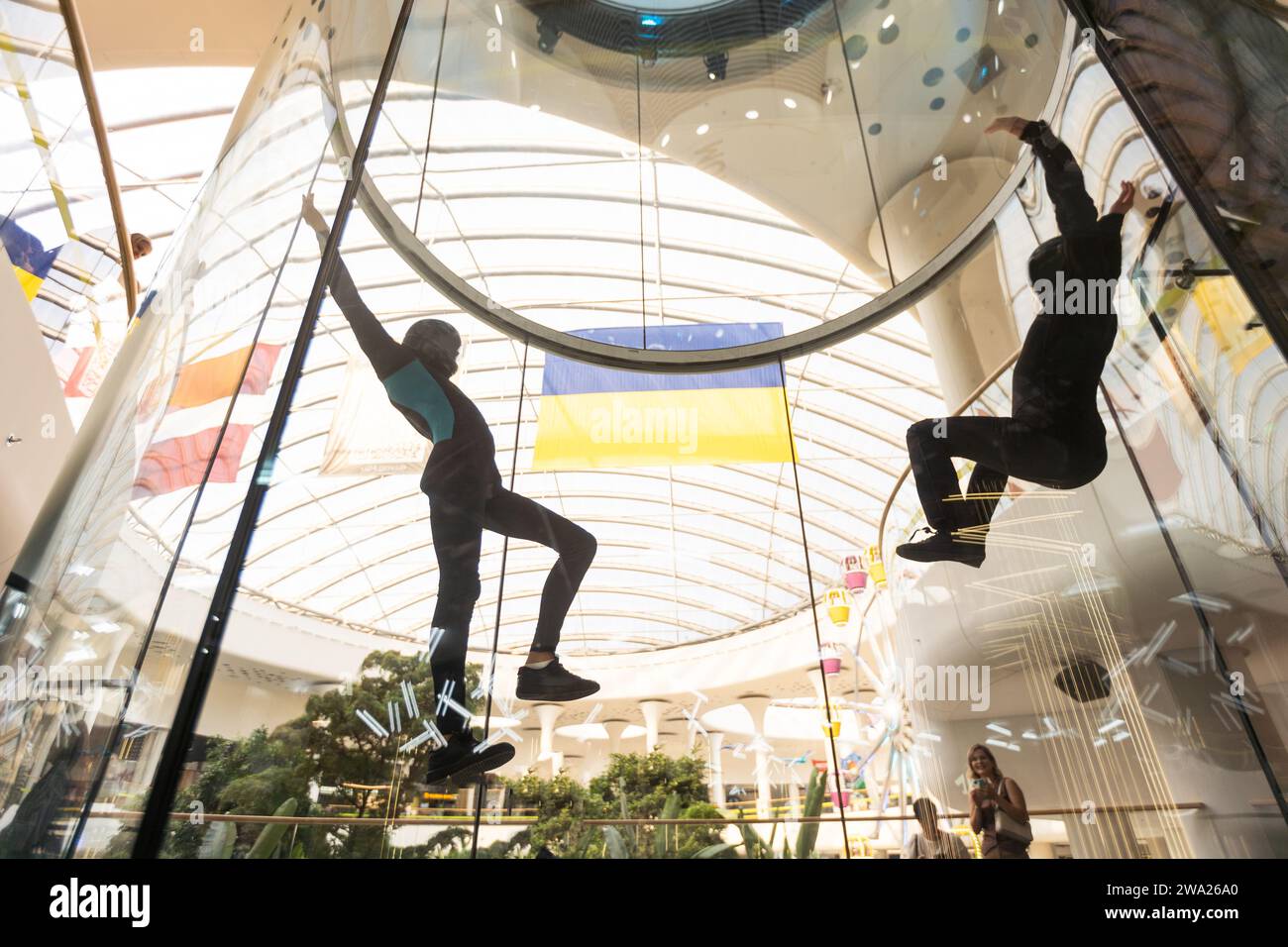 Indoor. Man fly in wind tunnel. Indoor skydiving. New fly sport Stock ...