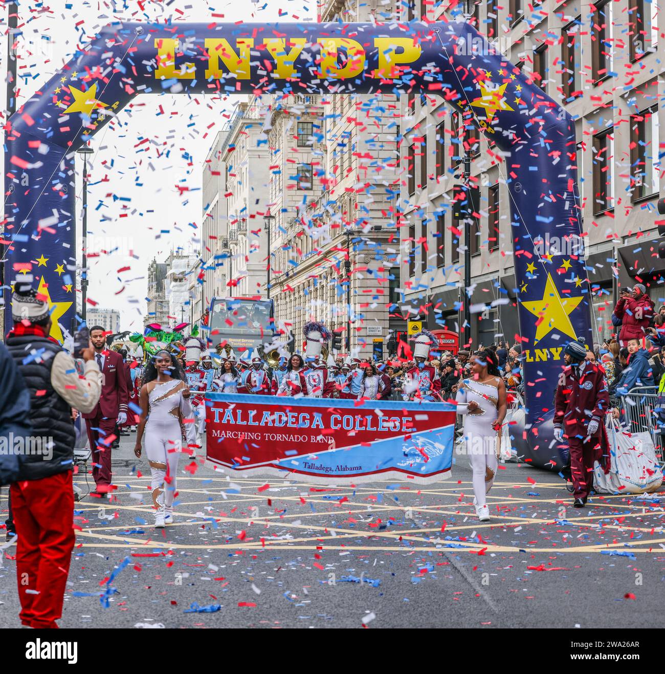 London, UK. 01st Jan, 2024. Crowds line up the streets of Central London today to enjoy The 37th ...