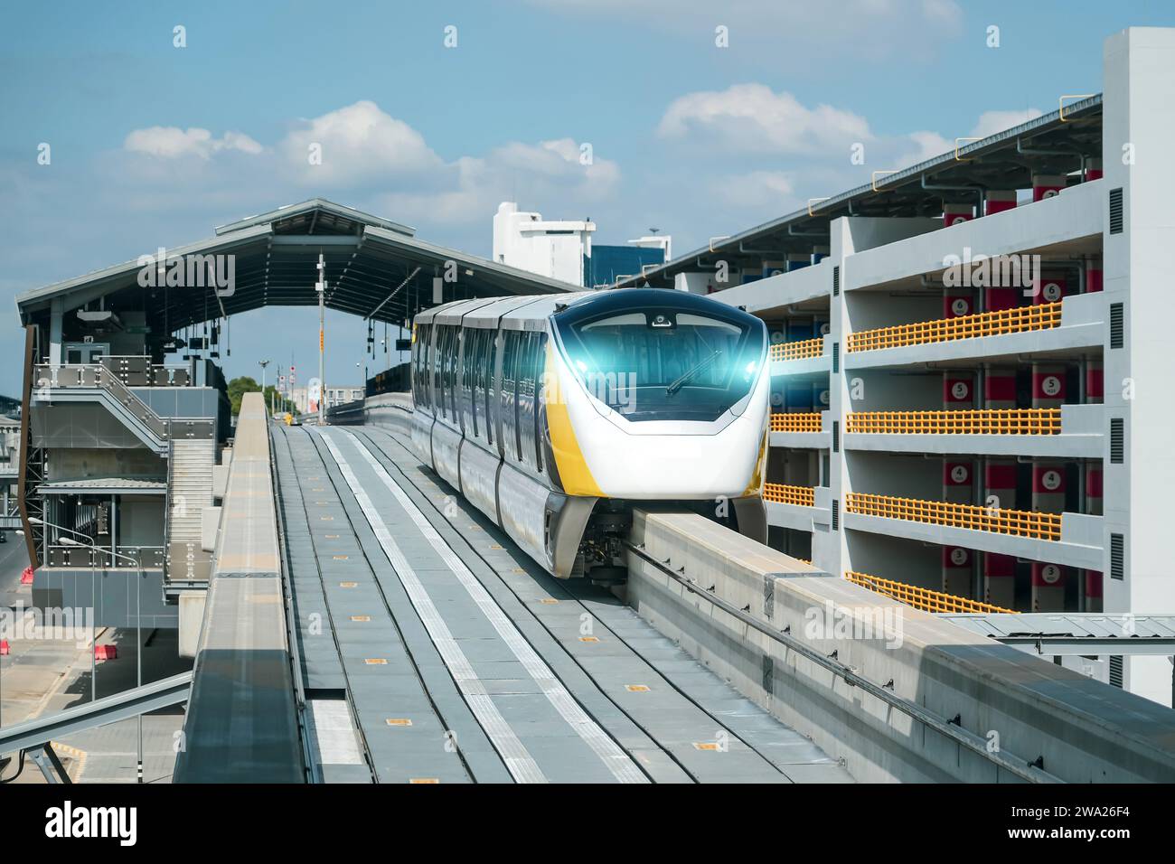 City electric passenger monorail train departs from a station in the ...