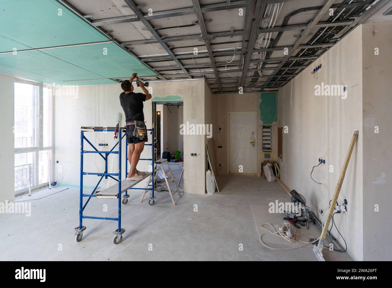 Man fasten ceiling profiles in hi-res stock photography and images - Alamy