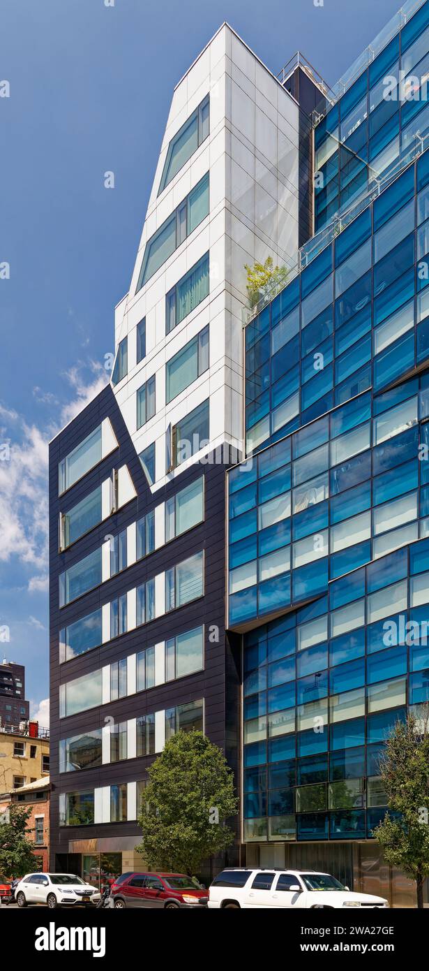 Angled volumes of black and white composite curtain wall enclose 459 ...