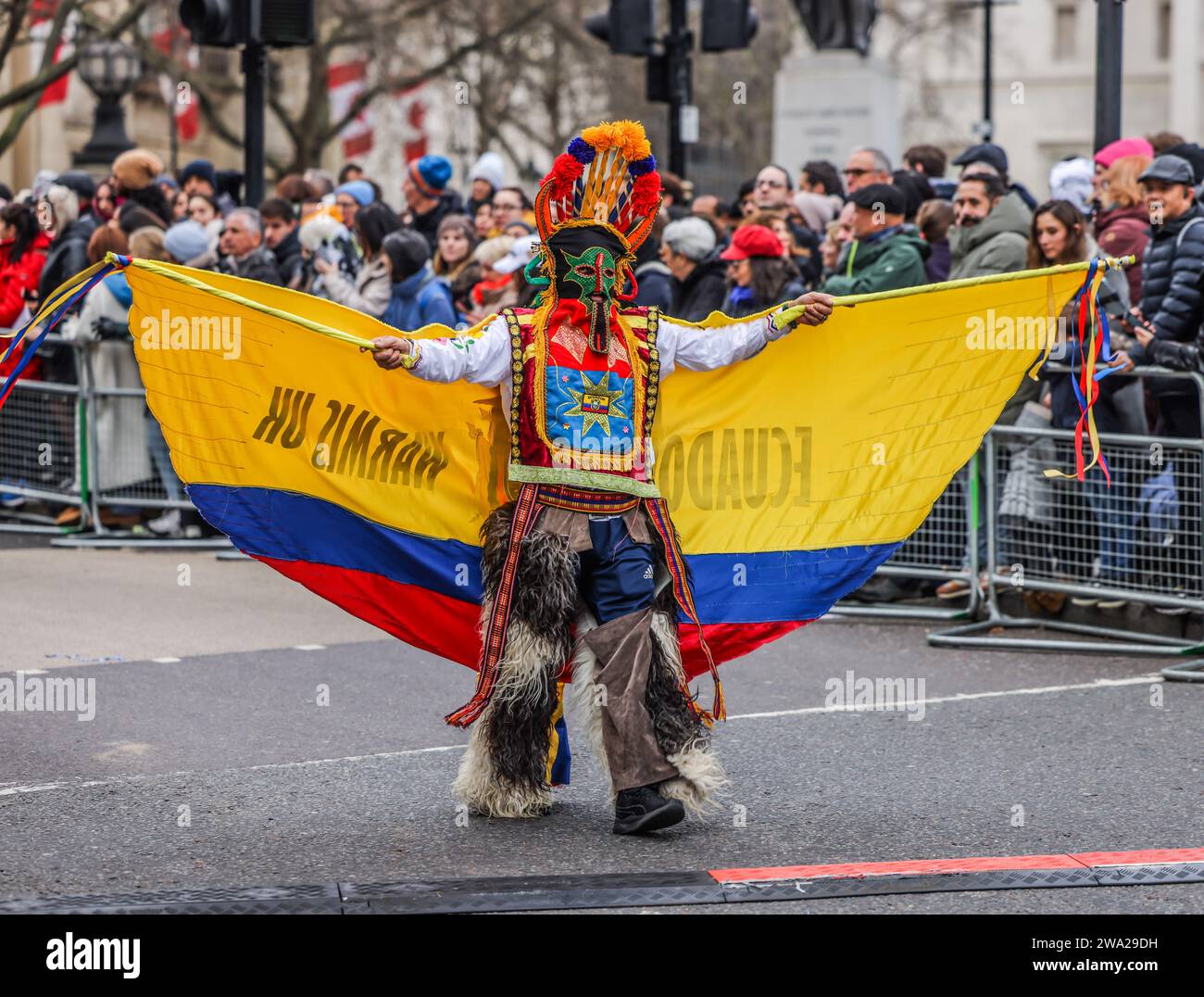 London, UK. 01st Jan, 2024. Crowds line up the streets of Central London today to enjoy The 37th ...