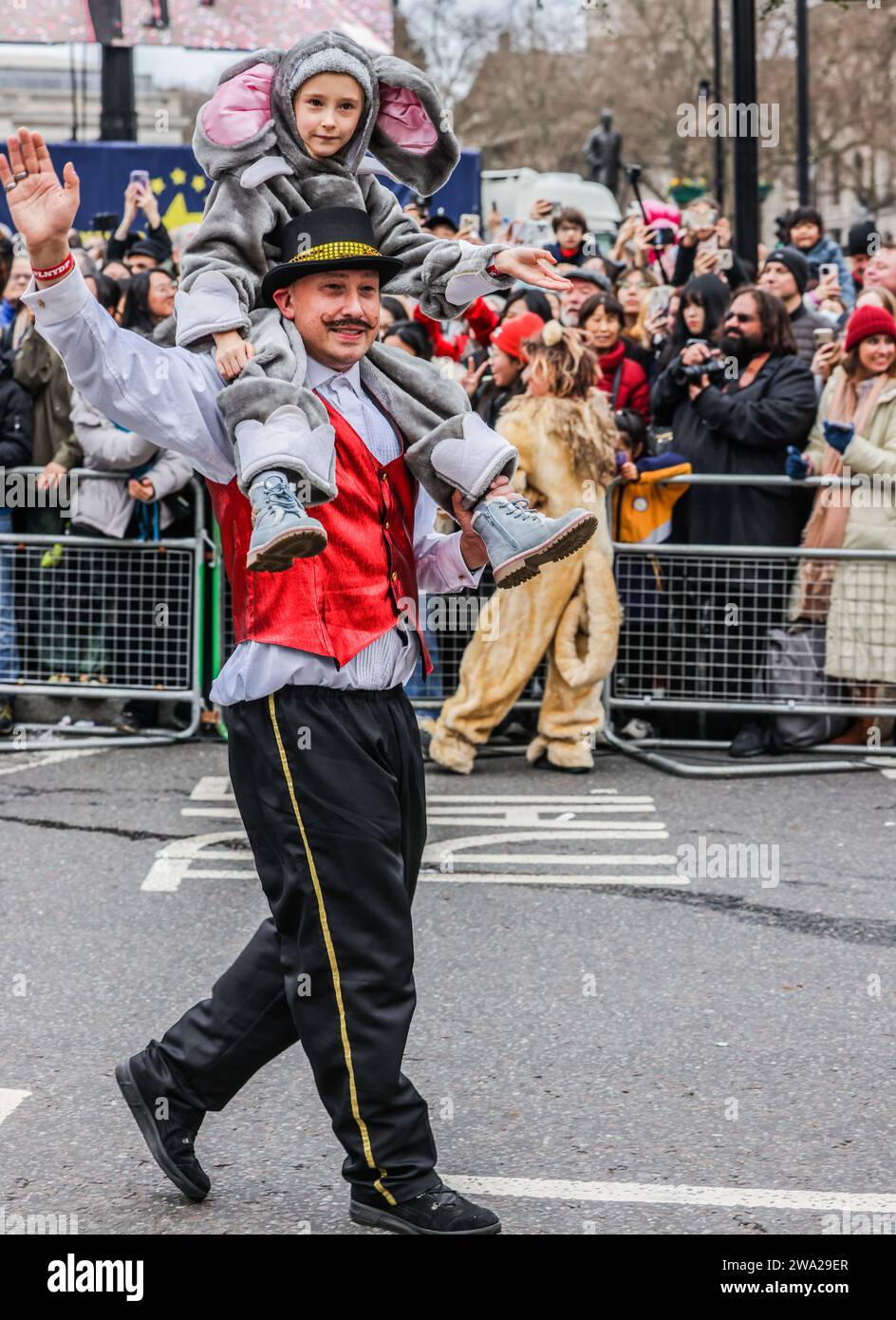 London, UK. 01st Jan, 2024. Crowds line up the streets of Central London today to enjoy The 37th ...