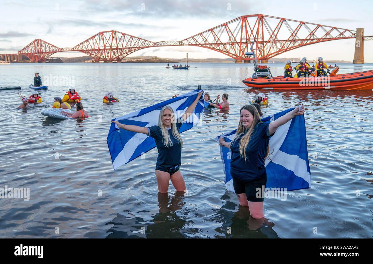 People take part in the Loony Dook New Year's Day dip in the Firth of ...