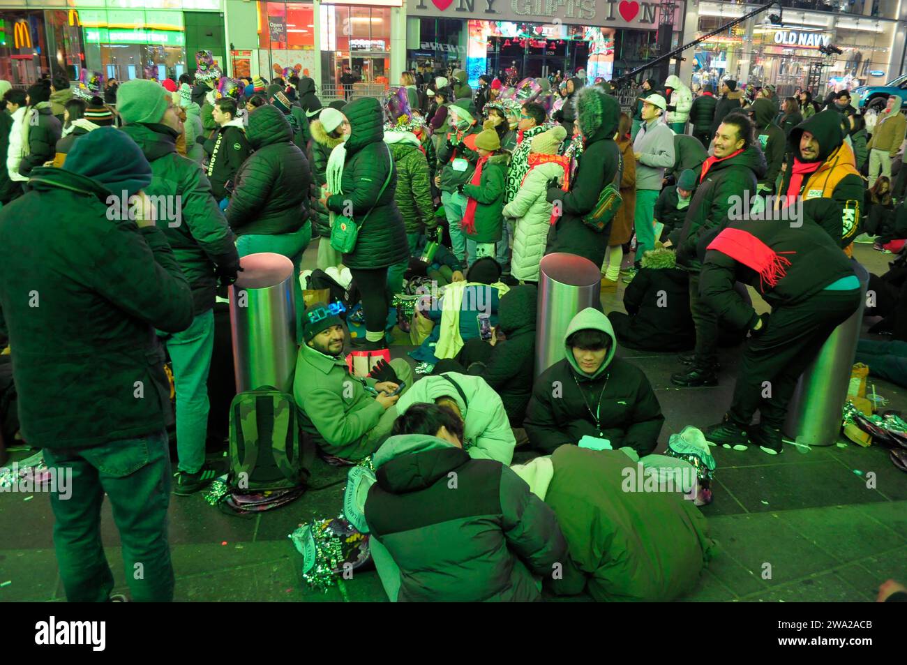 New York, United States. 31st Dec, 2023. A crowd of revelers, some ...