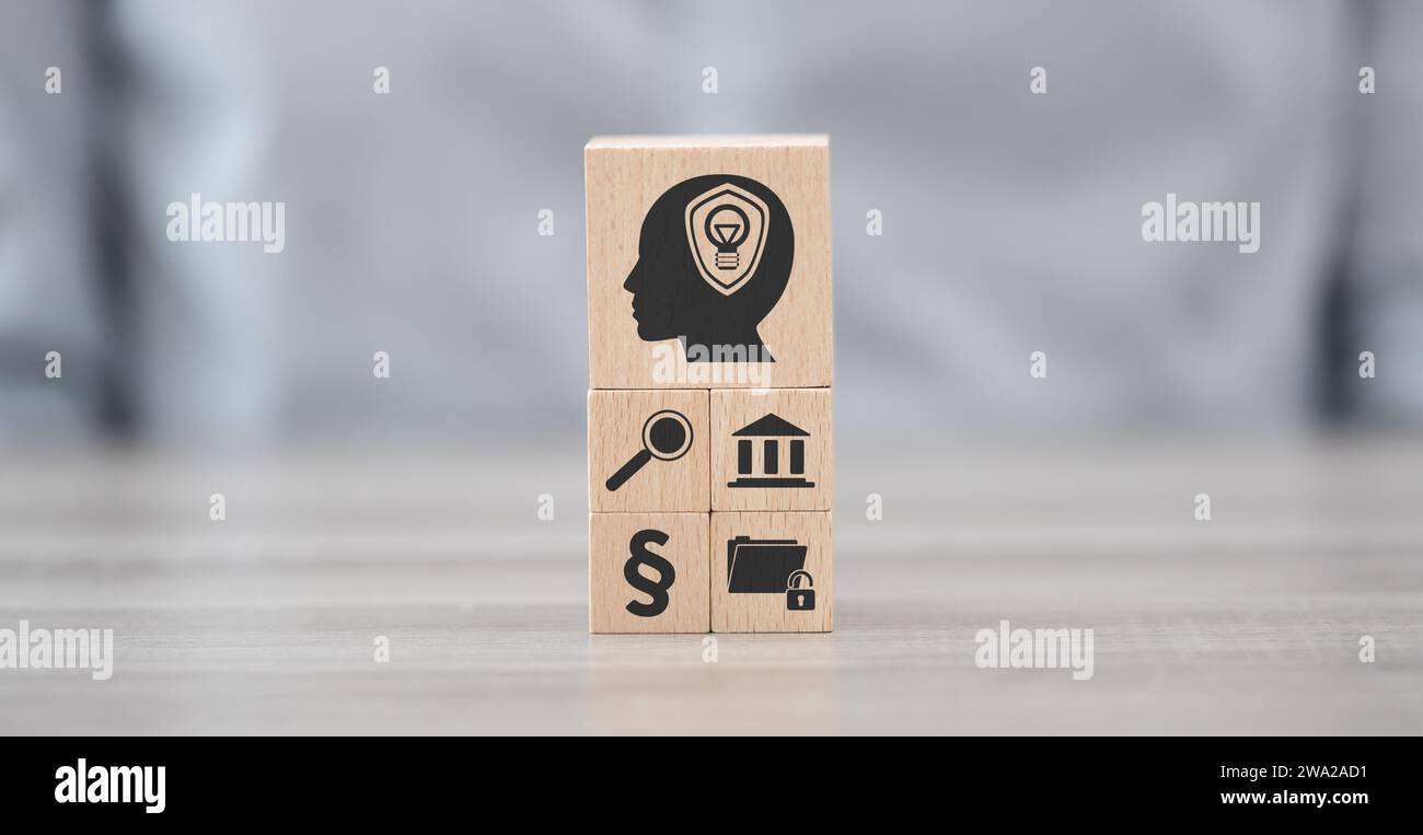 Wooden blocks with symbol of intellectual property concept Stock Photo ...