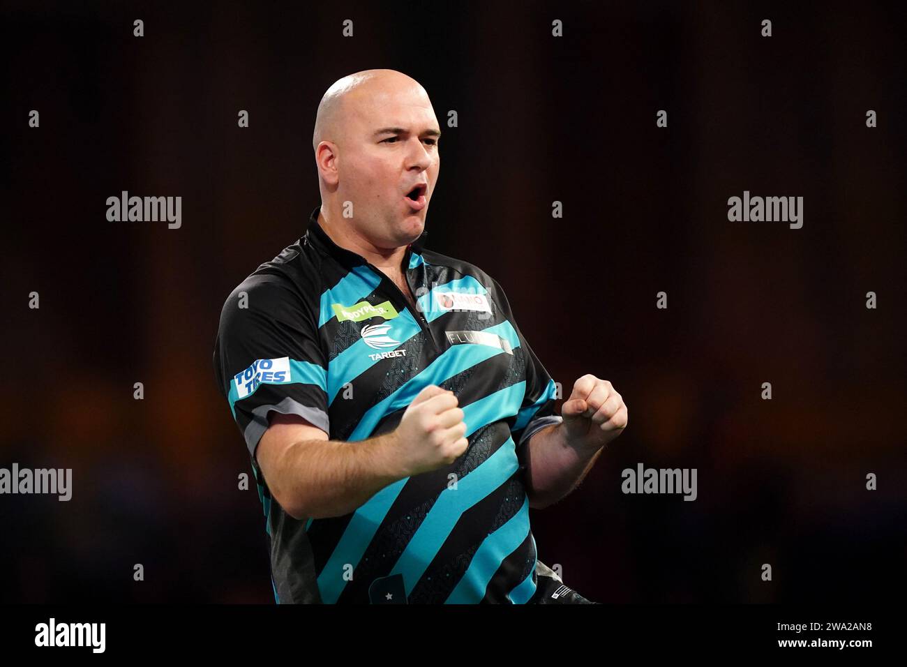 Rob Cross in action against Chris Dobey (not pictured) on day fourteen ...