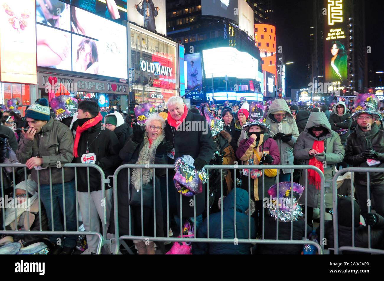 New York, United States. 31st Dec, 2023. A crowd of revelers, some ...