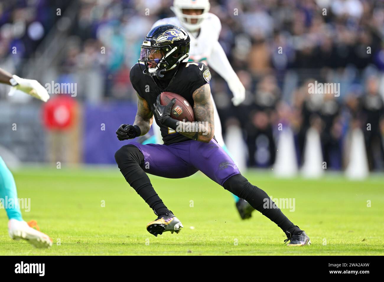Baltimore Ravens wide receiver Rashod Bateman (7) runs with the ball ...