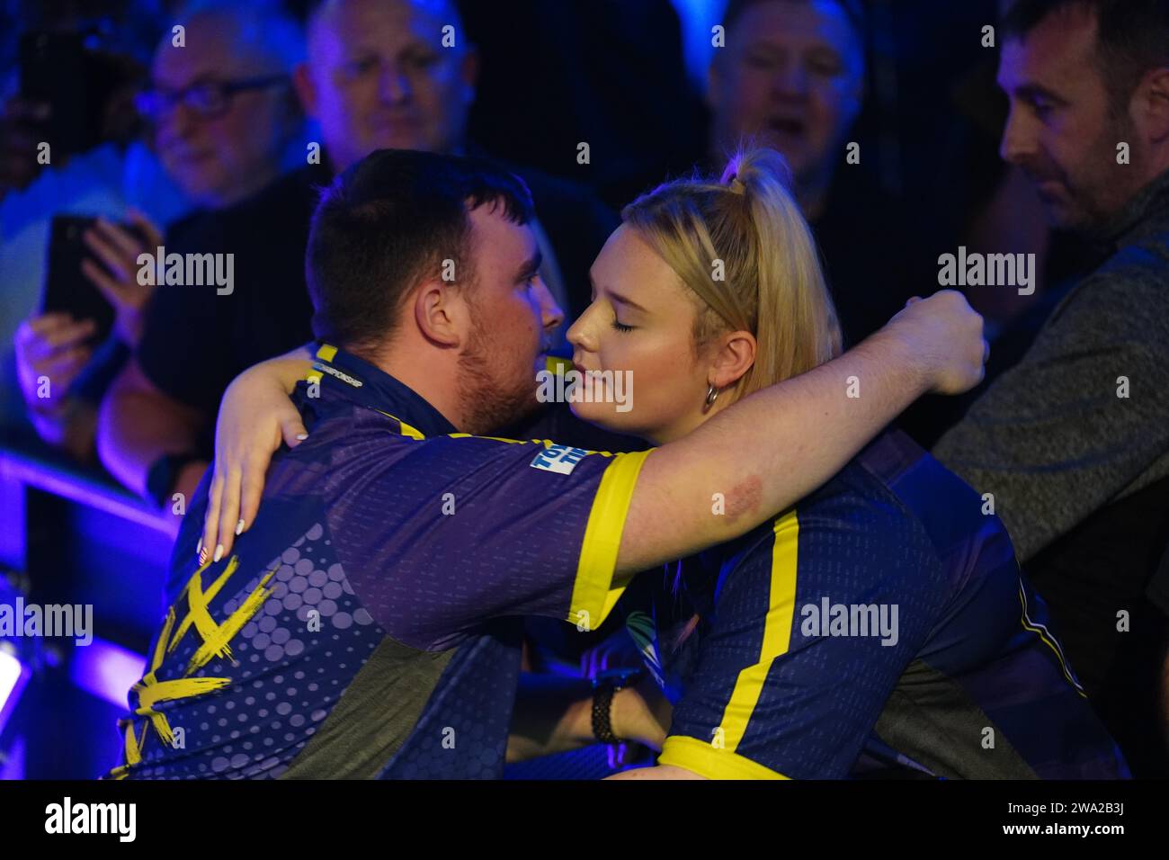 Luke Littler greets family before his match against Brendan Dolan (not ...